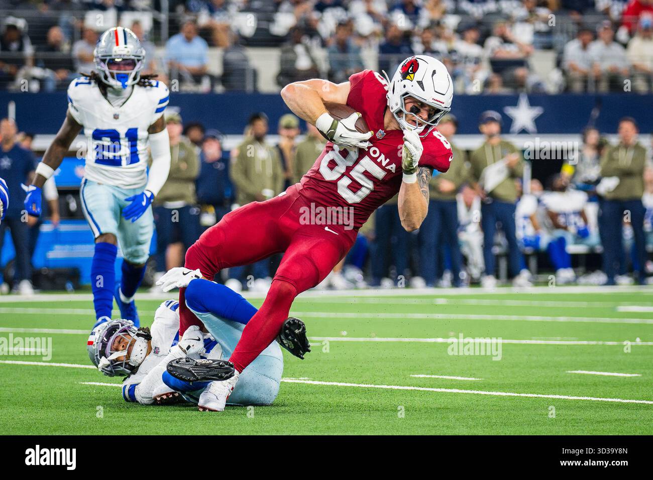 Arizona Cardinals tight end Trey McBride (85) is tackled by Dallas ...