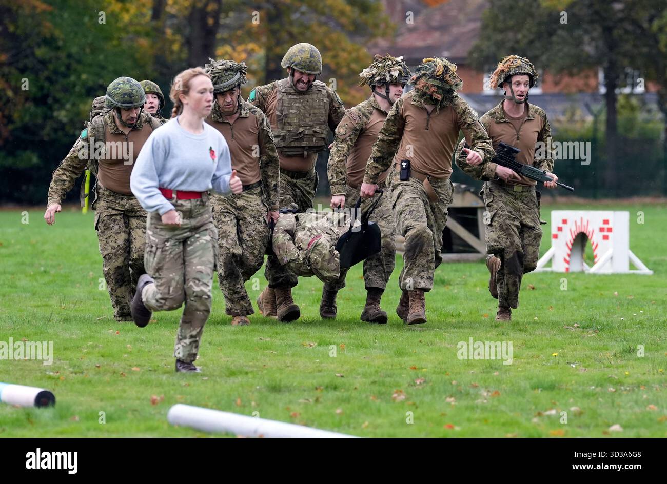 Soldiers take part in a stretcher bearer race during the Duchess of ...