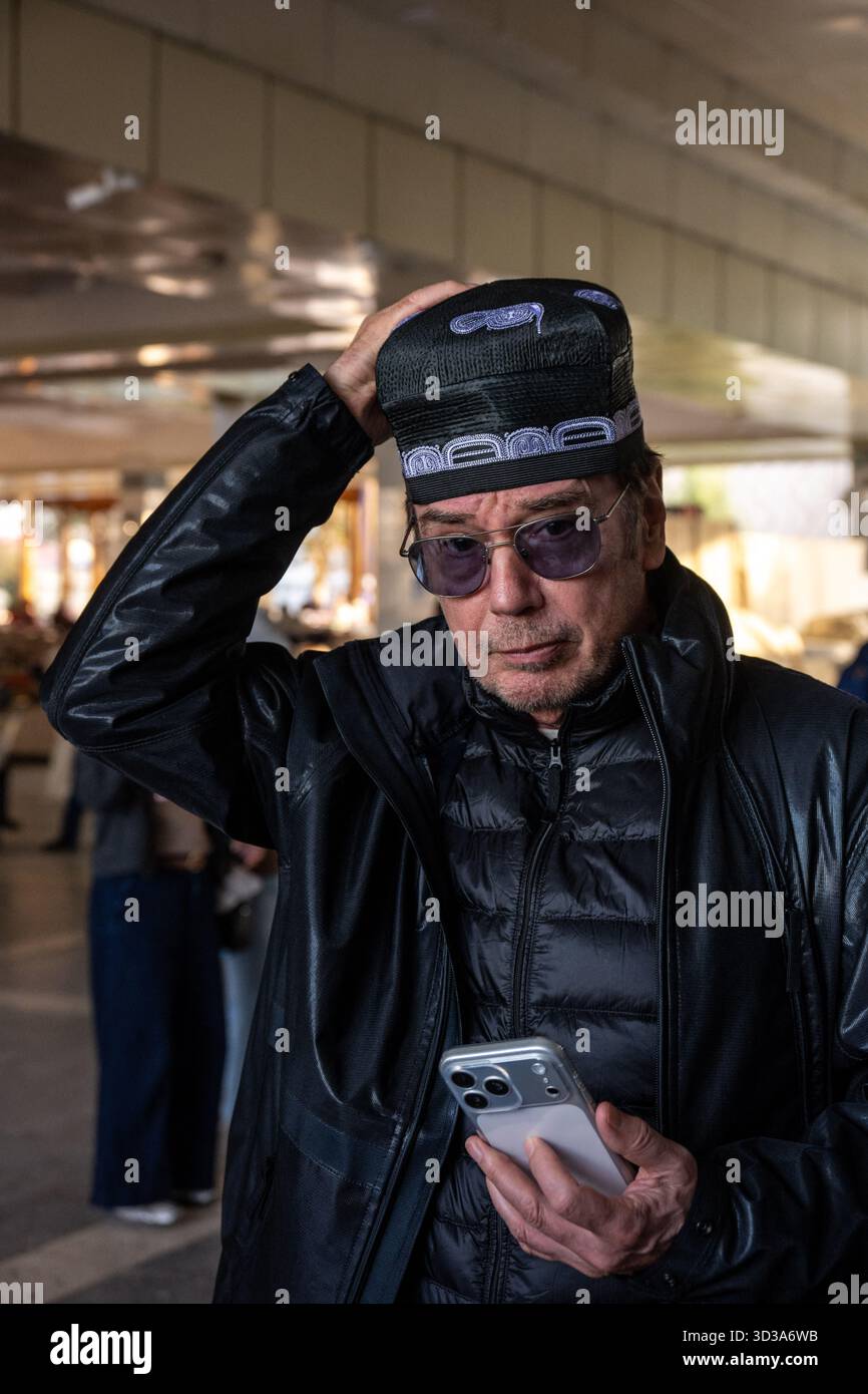 French music composer Jean-Michel Jarre tries a ‘doppa’ the local Uzbek ...