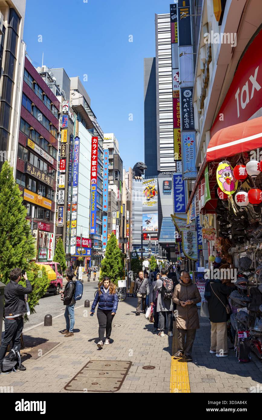 Street scene with skyscrapers, figure Godzilla head on a skyscraper ...
