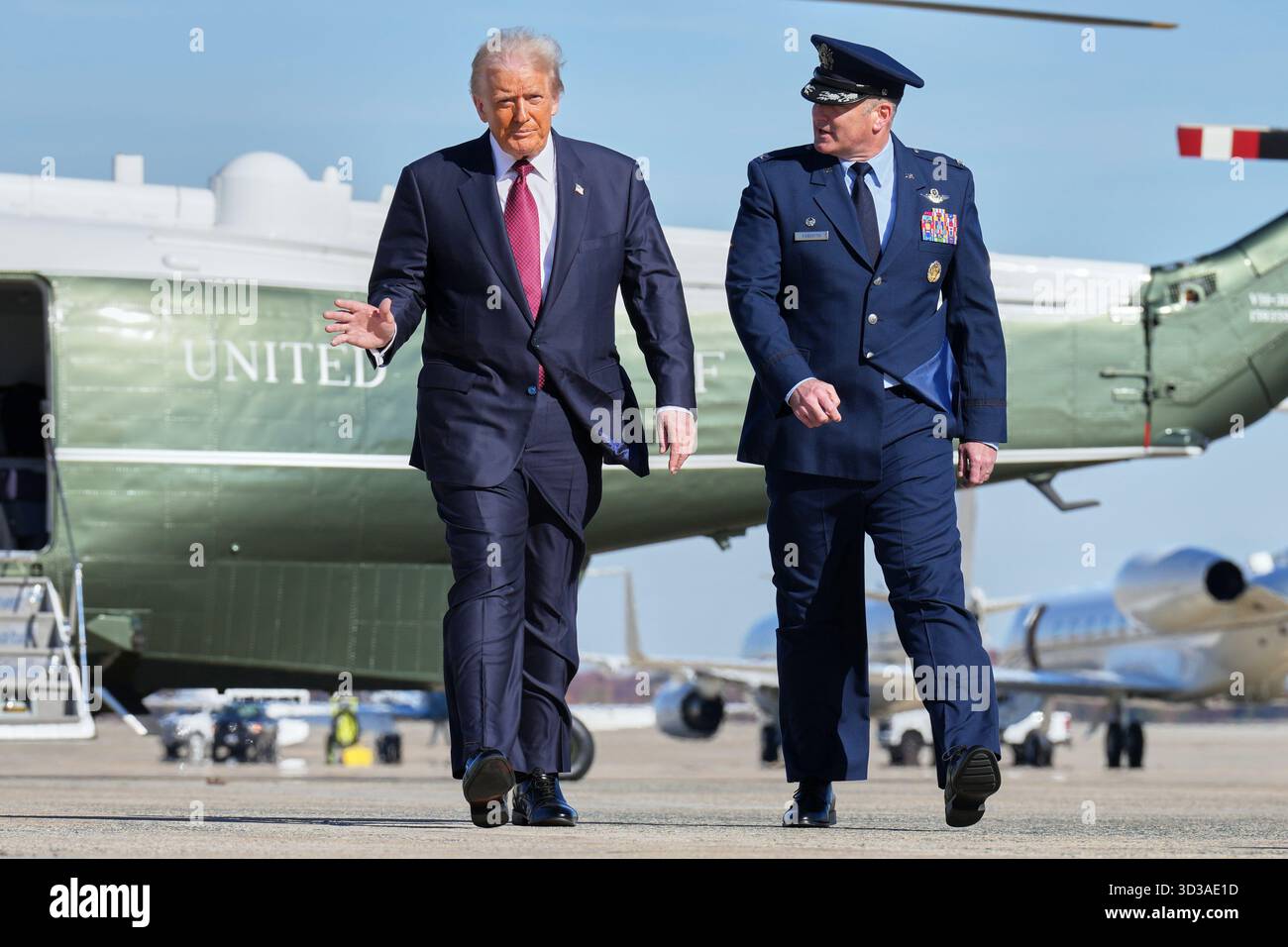 President Donald Trump, left, is escorted by Air Force Col. Christopher ...
