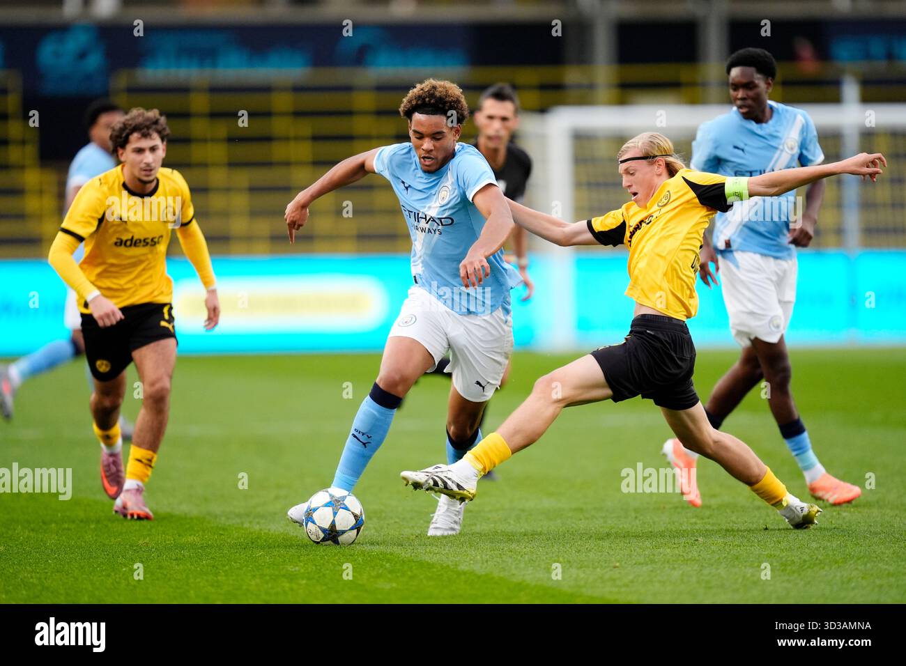 Manchester City's Floyd Samba (left) and Borussia Dortmund's Luke ...
