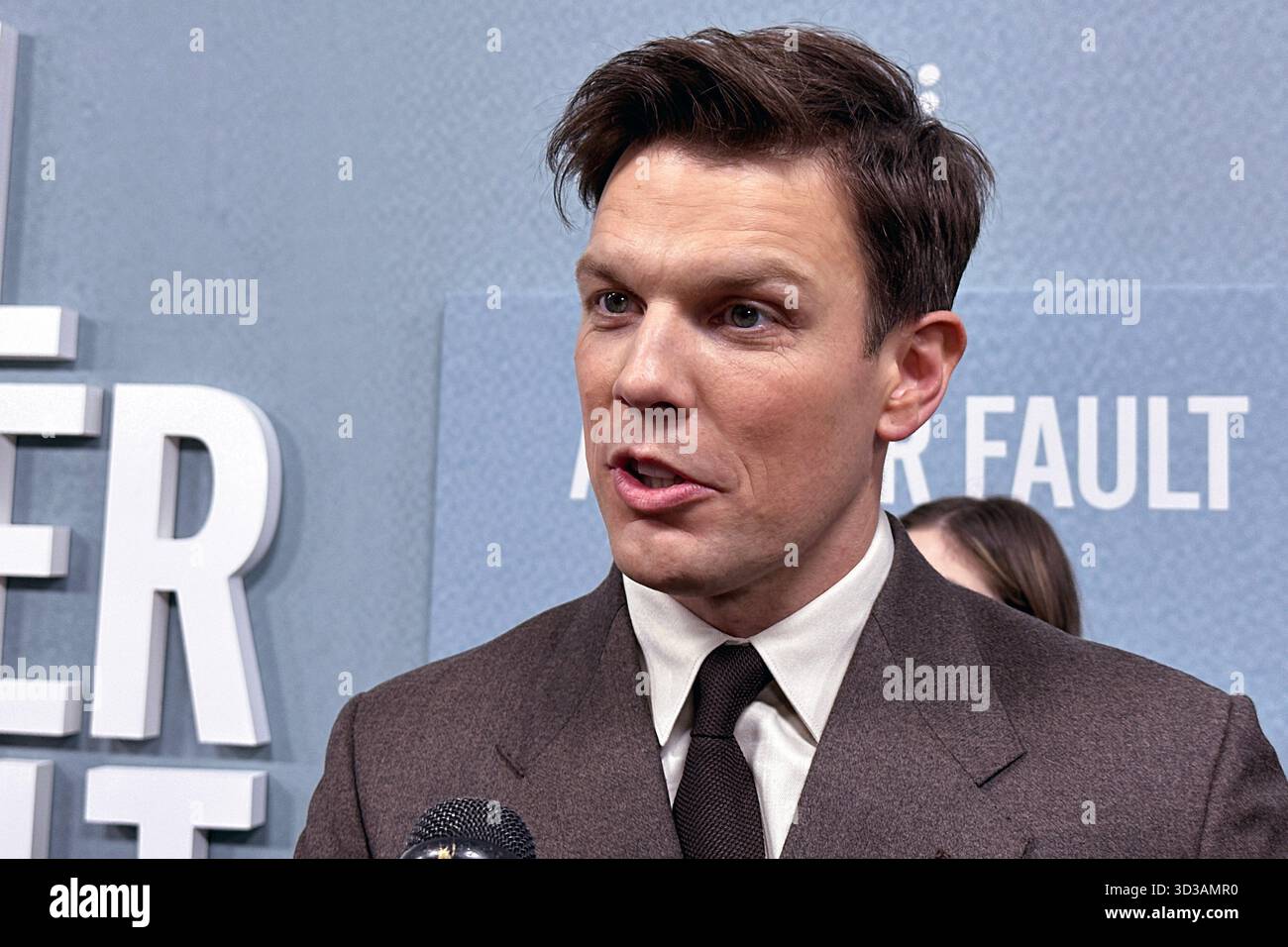 Jake Lacy speaks with the media at the premiere of "All Her Fault" at ...