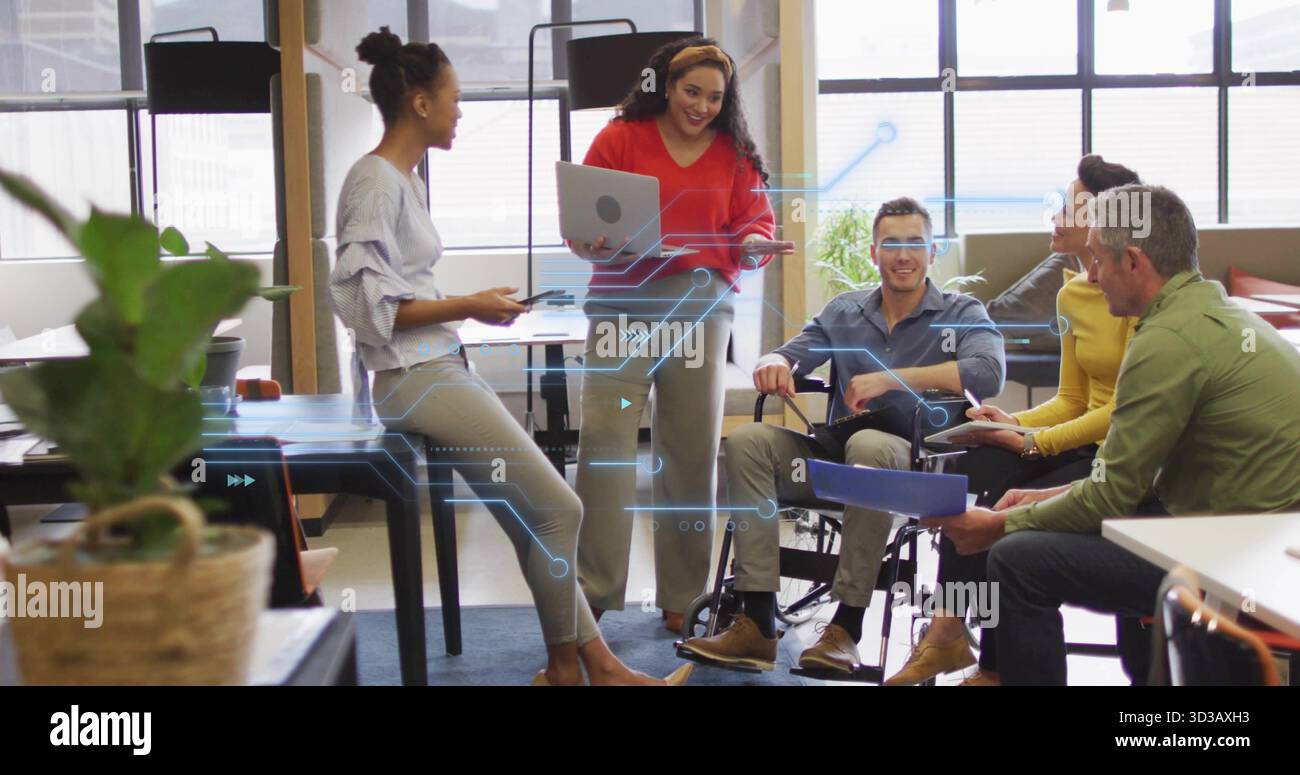 Presenting circuit overlay, colleagues collaborating at office table ...