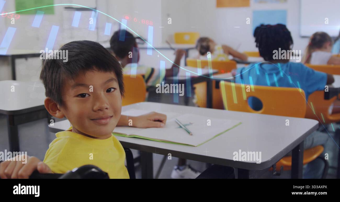 Smiling boy in yellow t-shirt writing in notebook at white desk in ...