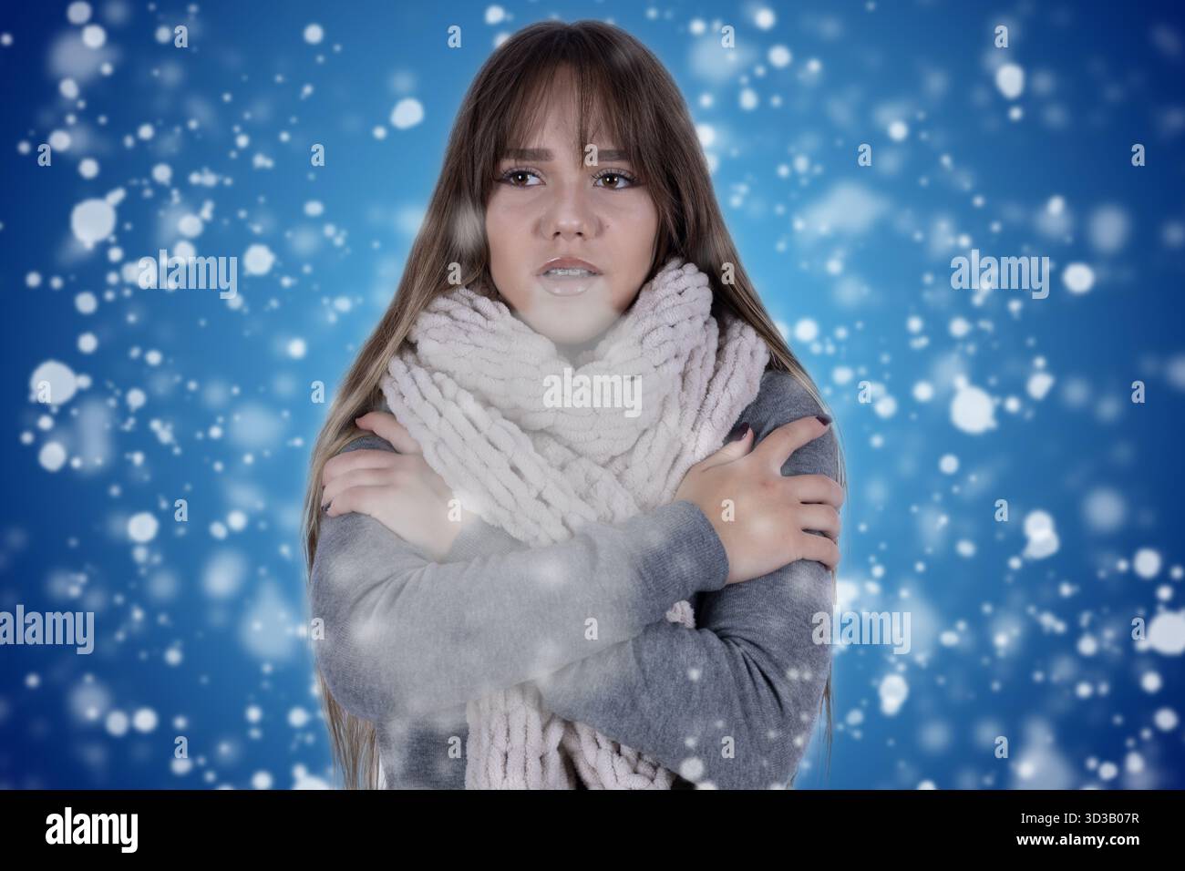 The woman is shivering and hugging herself to stay warm in the cold ...