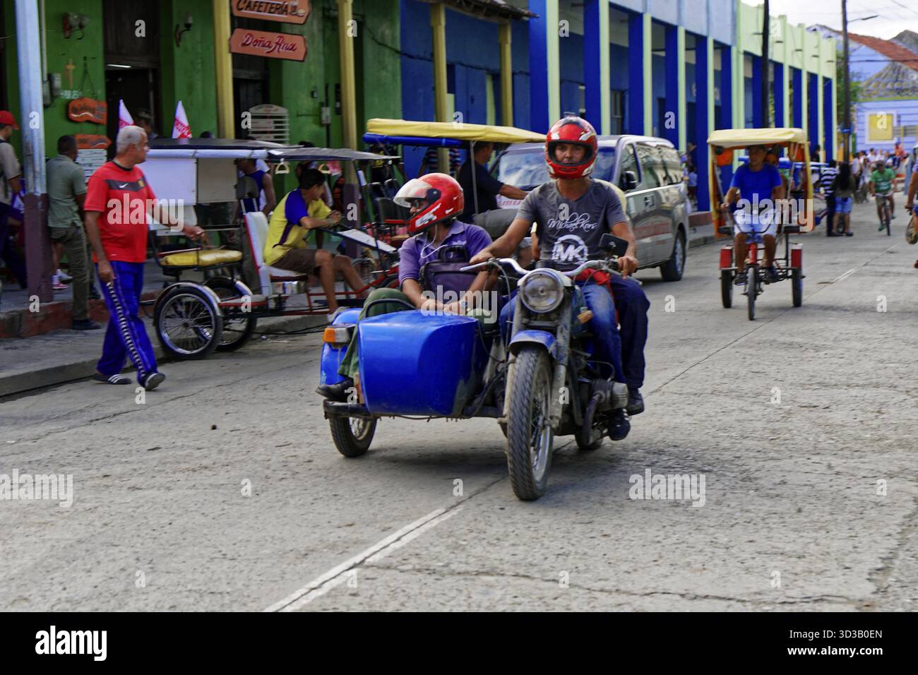 Baracoa, Cuba, Central America, A motorcycle with a sidecar and two ...