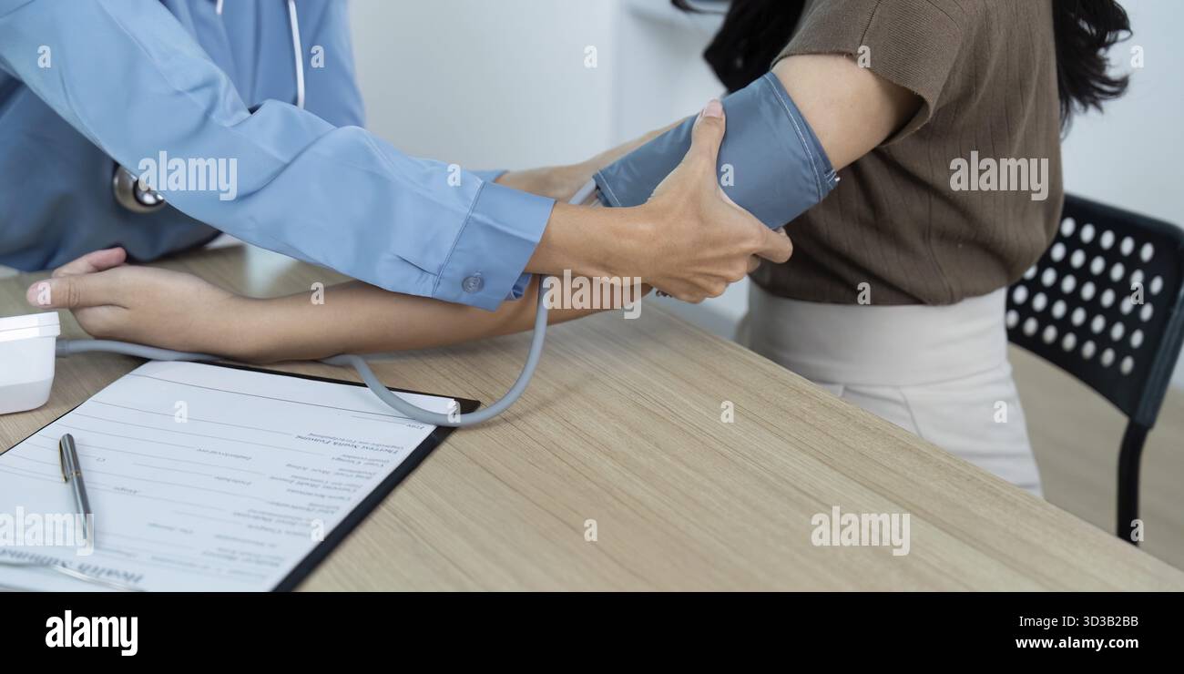 Nurse uses sphygmomanometer measure hi-res stock photography and images ...