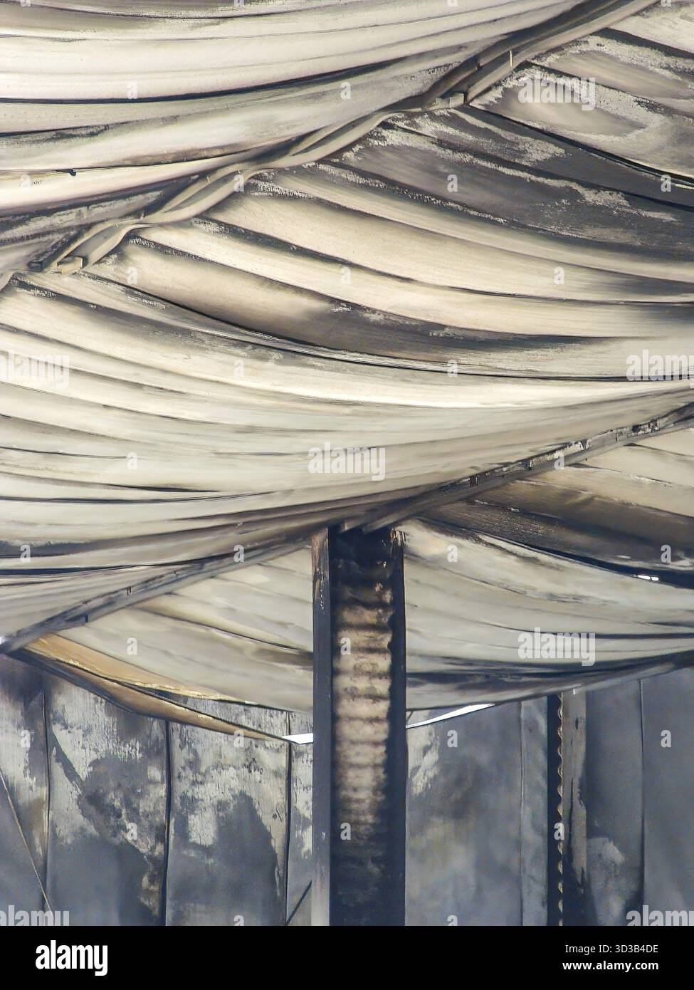 The warehouse after the fire. The metal frame of the building burned ...