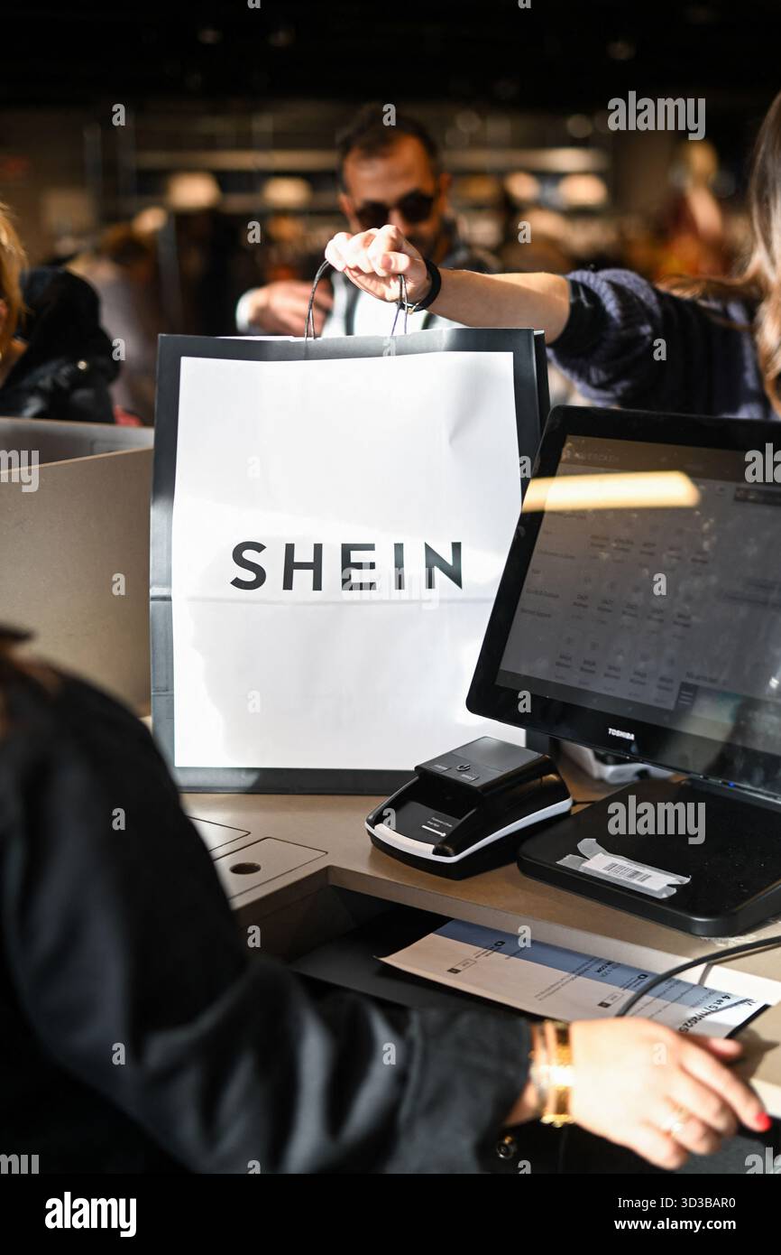 People visit the Shein's first permanent store during its opening day ...