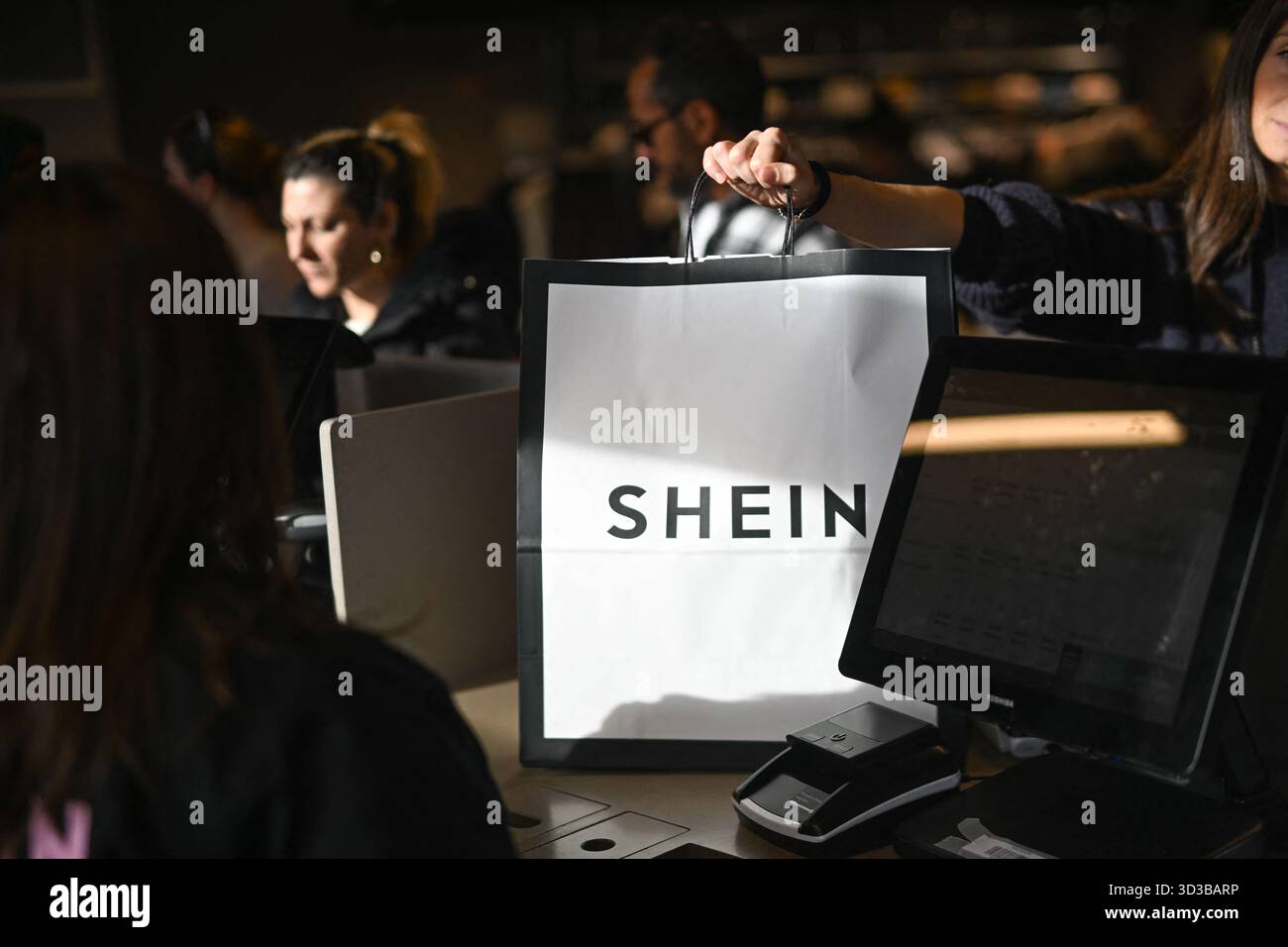 People visit the Shein's first permanent store during its opening day ...