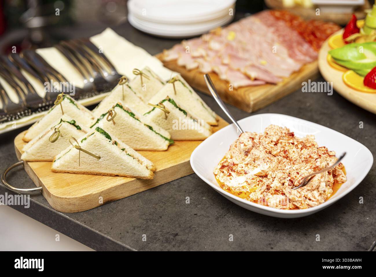Food, Elegant catering spread featuring triangle sandwiches, paprika ...