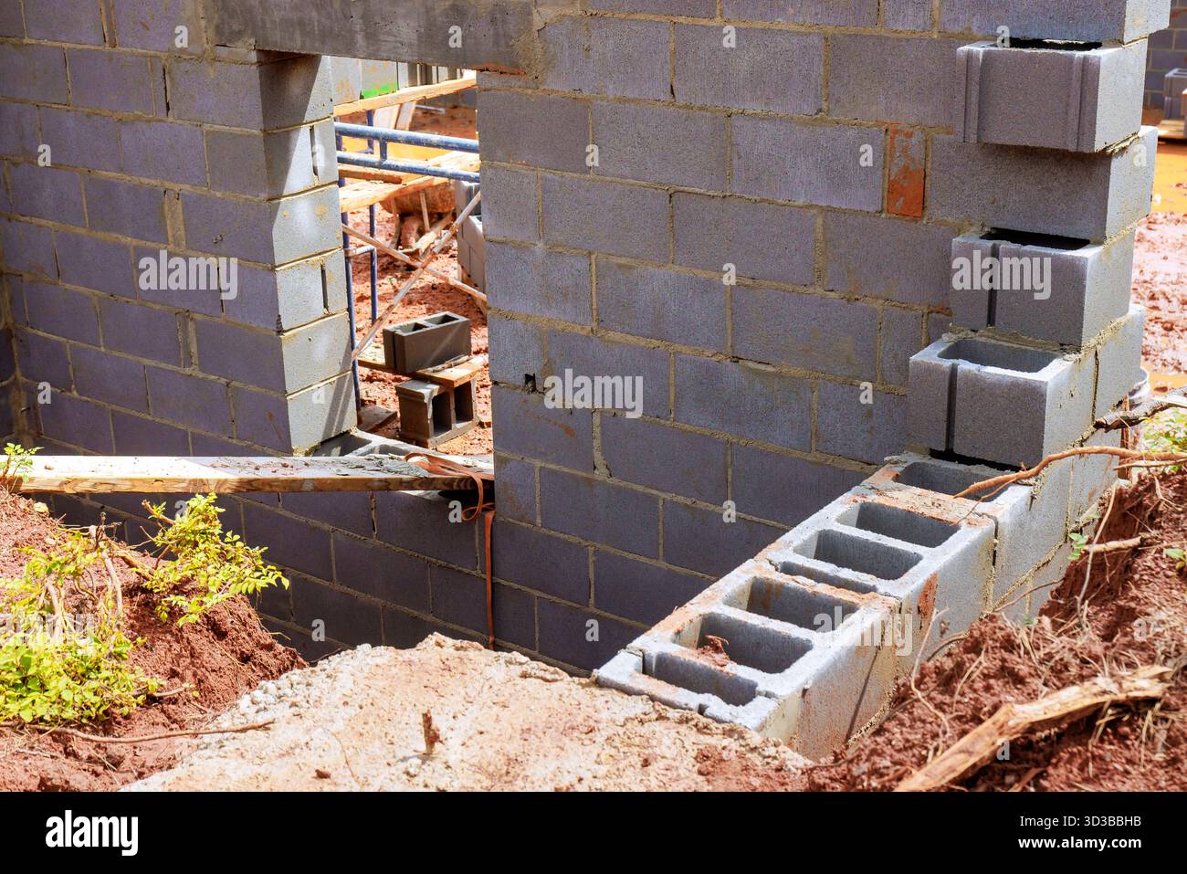 Construction site where cinder blocks are being laid out unfinished ...
