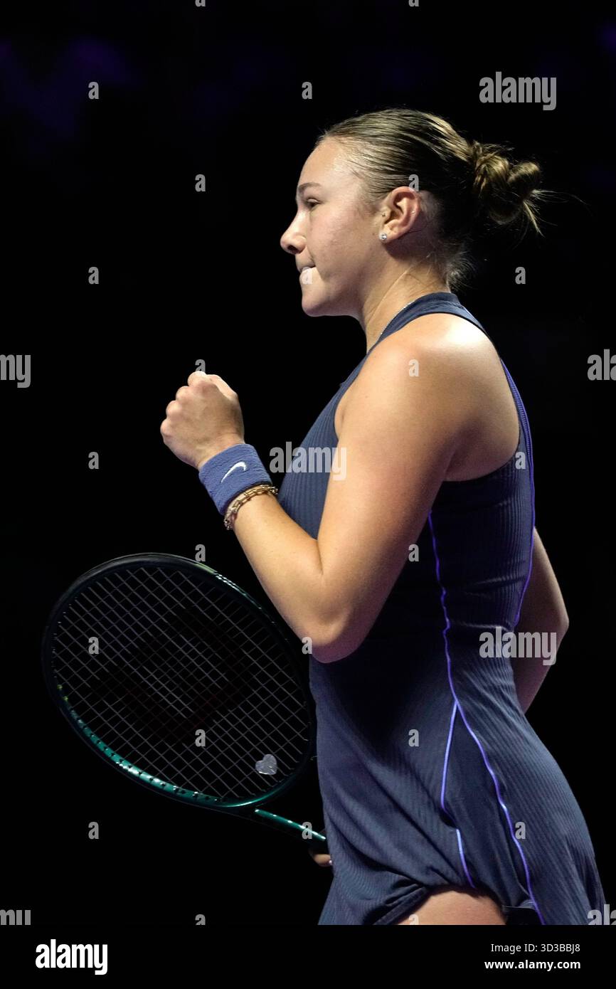 Amanda Anisimova of the United States gestures after winning a point ...
