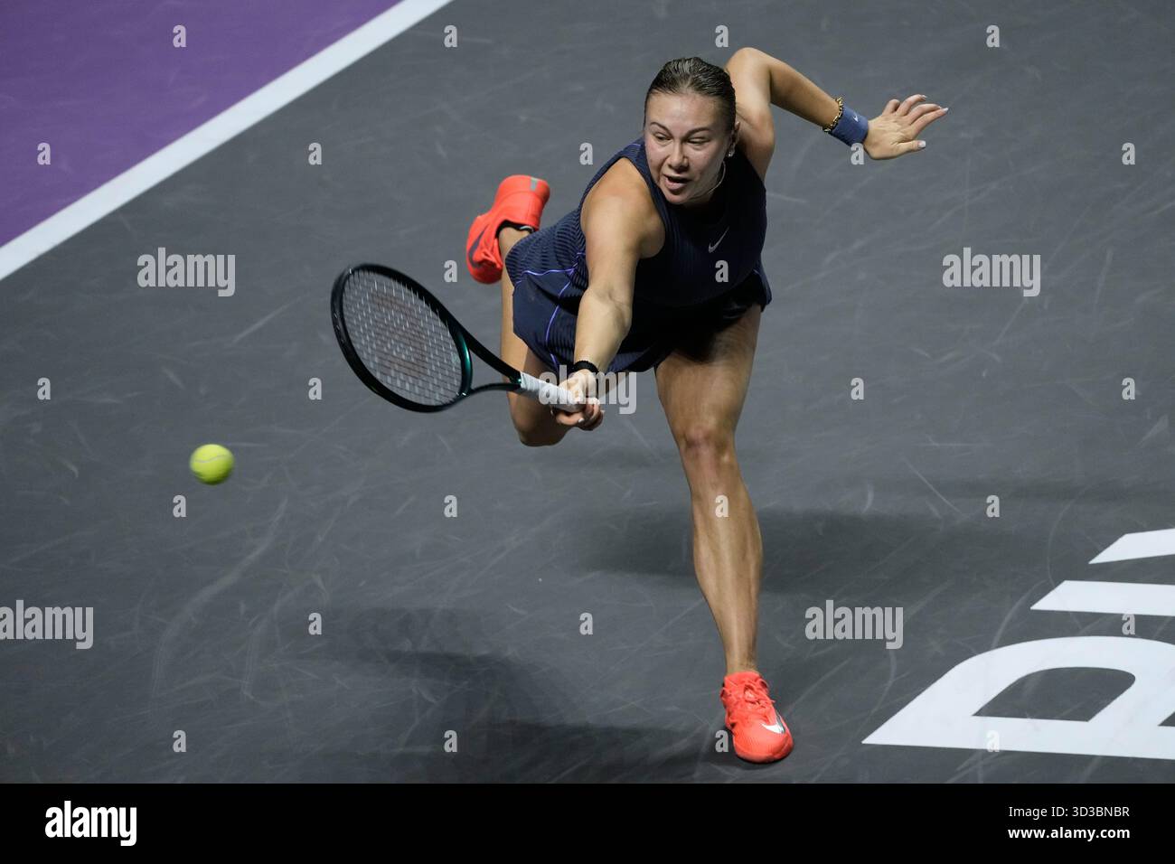 Amanda Anisimova of the United States lunges to return a ball to Iga ...