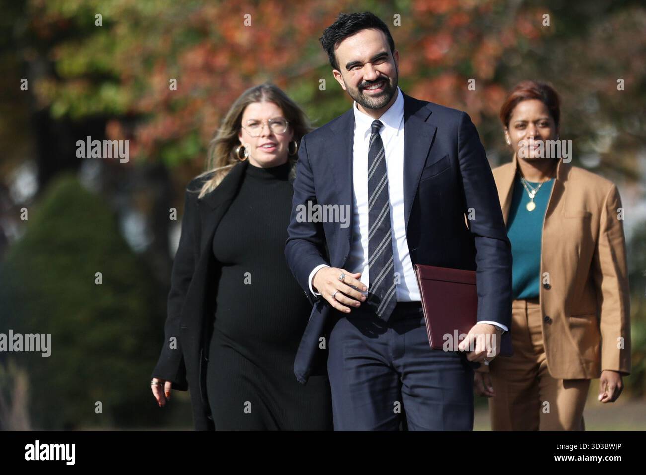 New York City mayor-elect Zohran Mamdani, center, walks with members of ...