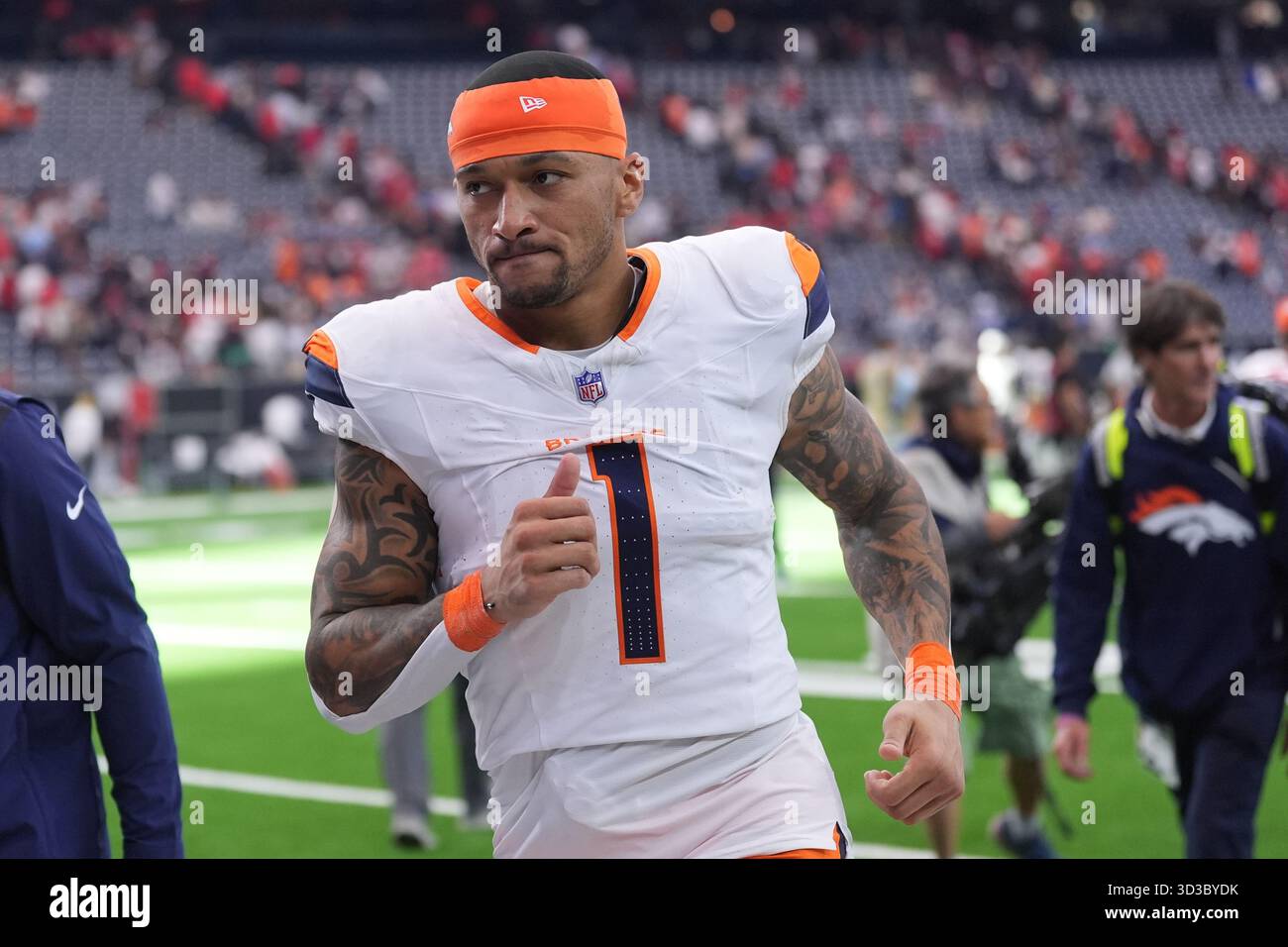 Denver Broncos tight end Evan Engram (1) runs off the field after an ...