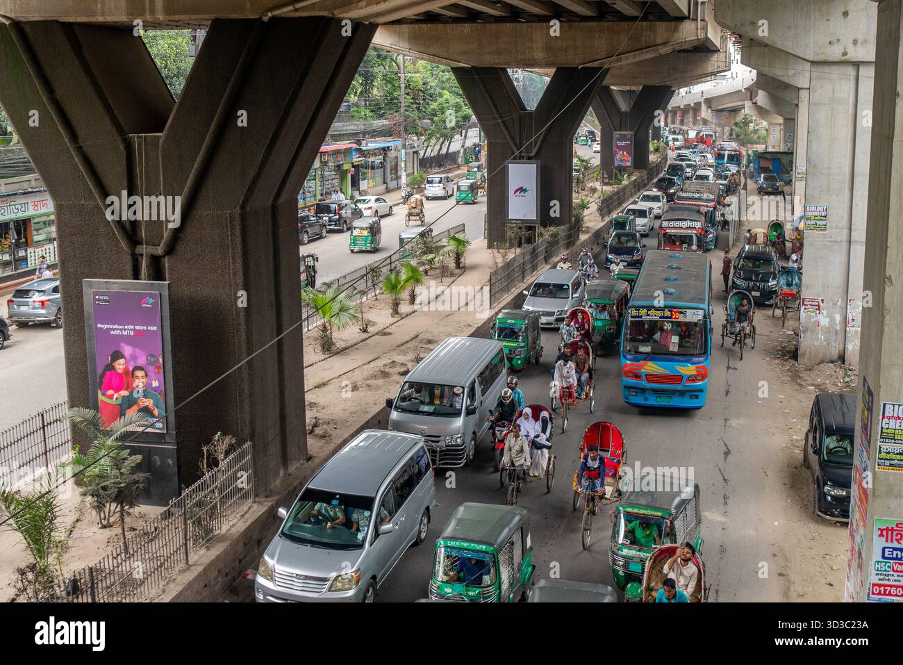Busy Urban Street with Traffic and Elevated Roadway. This is a daily ...