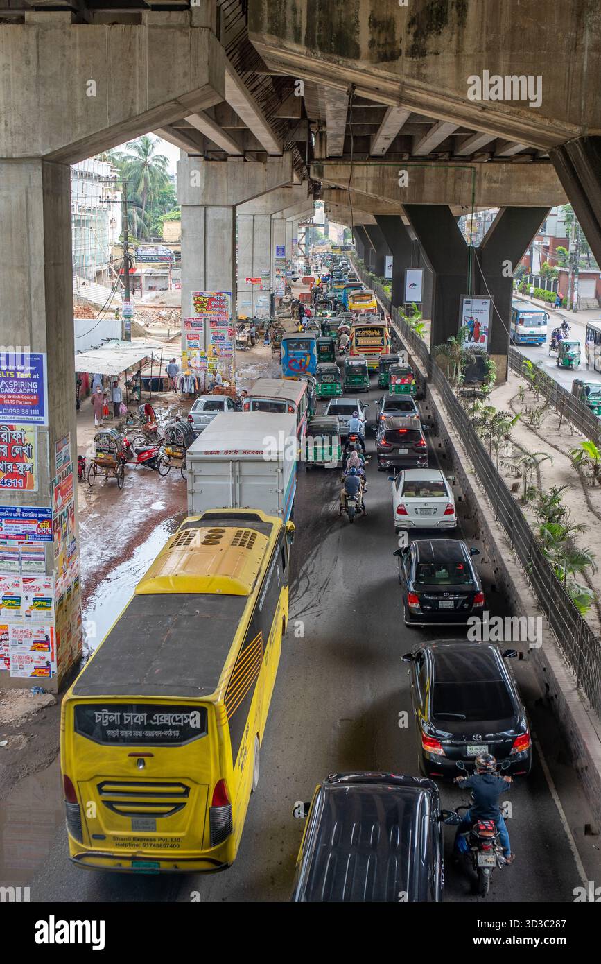 Busy Urban Street with Traffic and Elevated Roadway. This is a daily ...