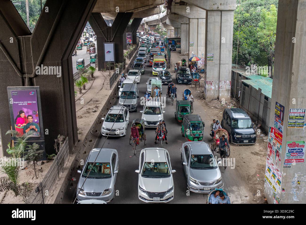 Busy Urban Street with Traffic and Elevated Roadway. This is a daily ...