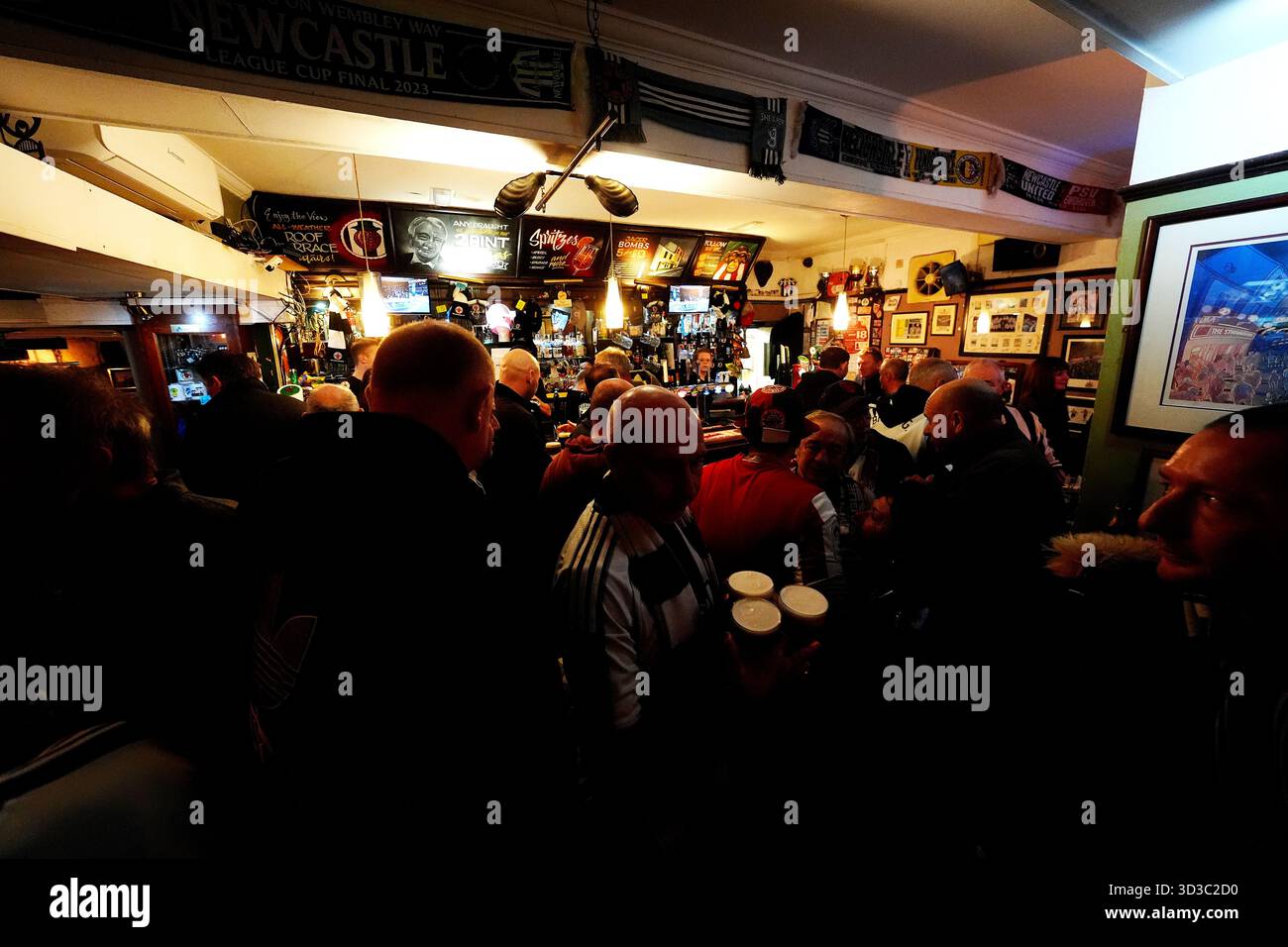 Newcastle United fans enjoy a drink at the The Strawberry Pub in ...