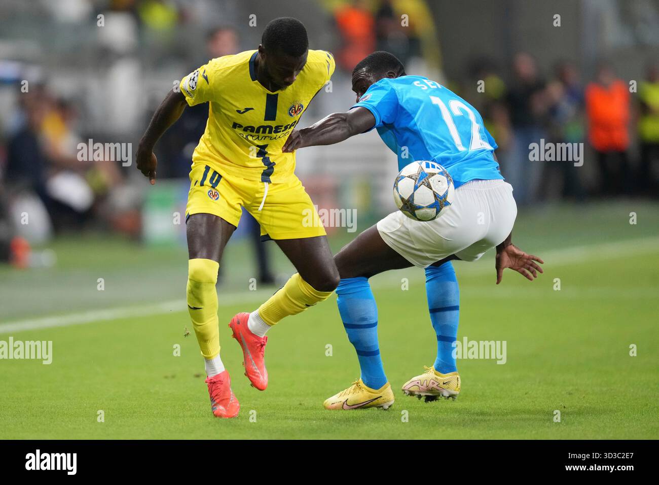 Pafos' Ken Sema, right, holds Villarreal's Nicolas Pepe during the ...
