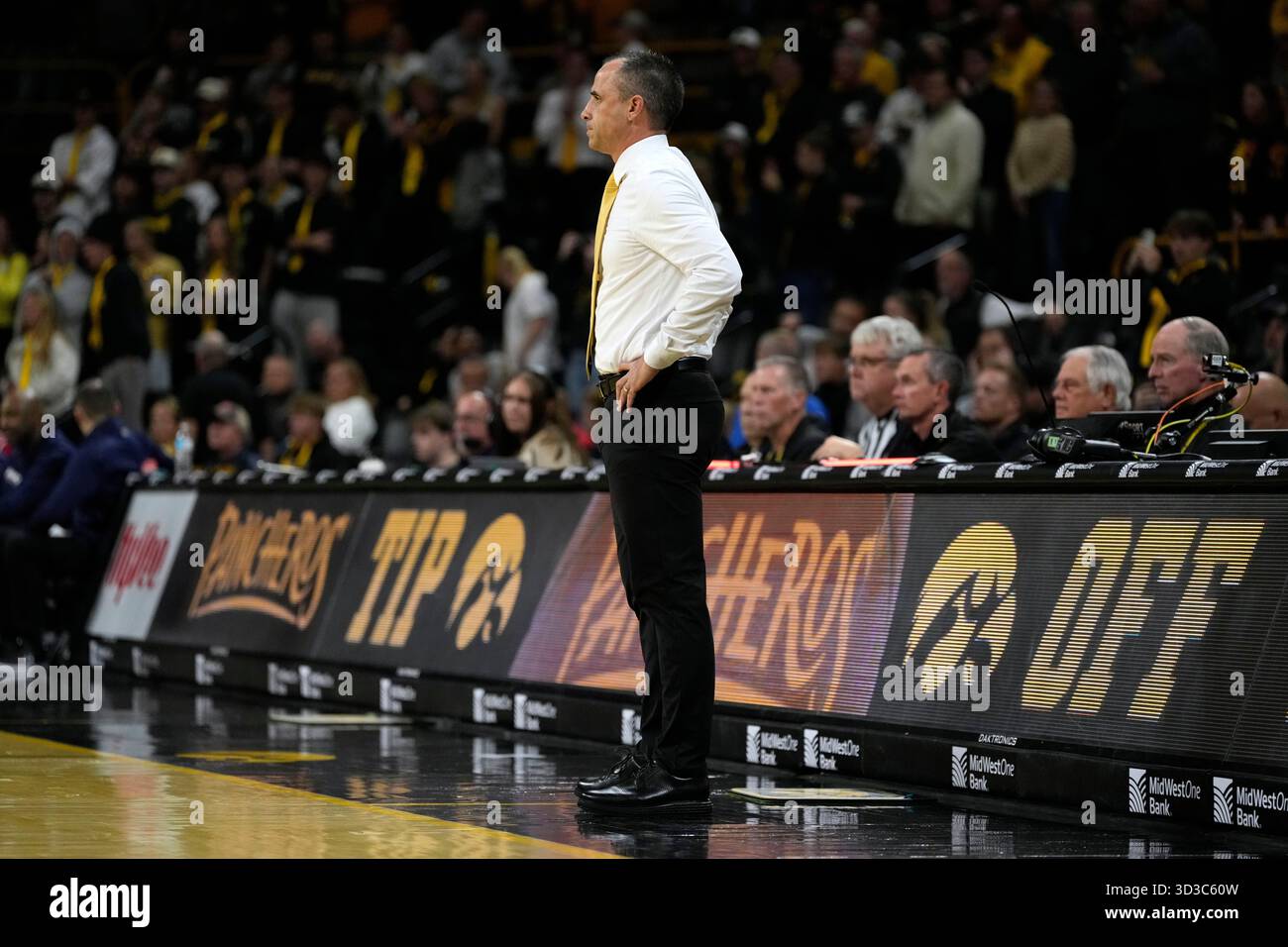Iowa head coach Ben McCollum watches from the bench during the first ...