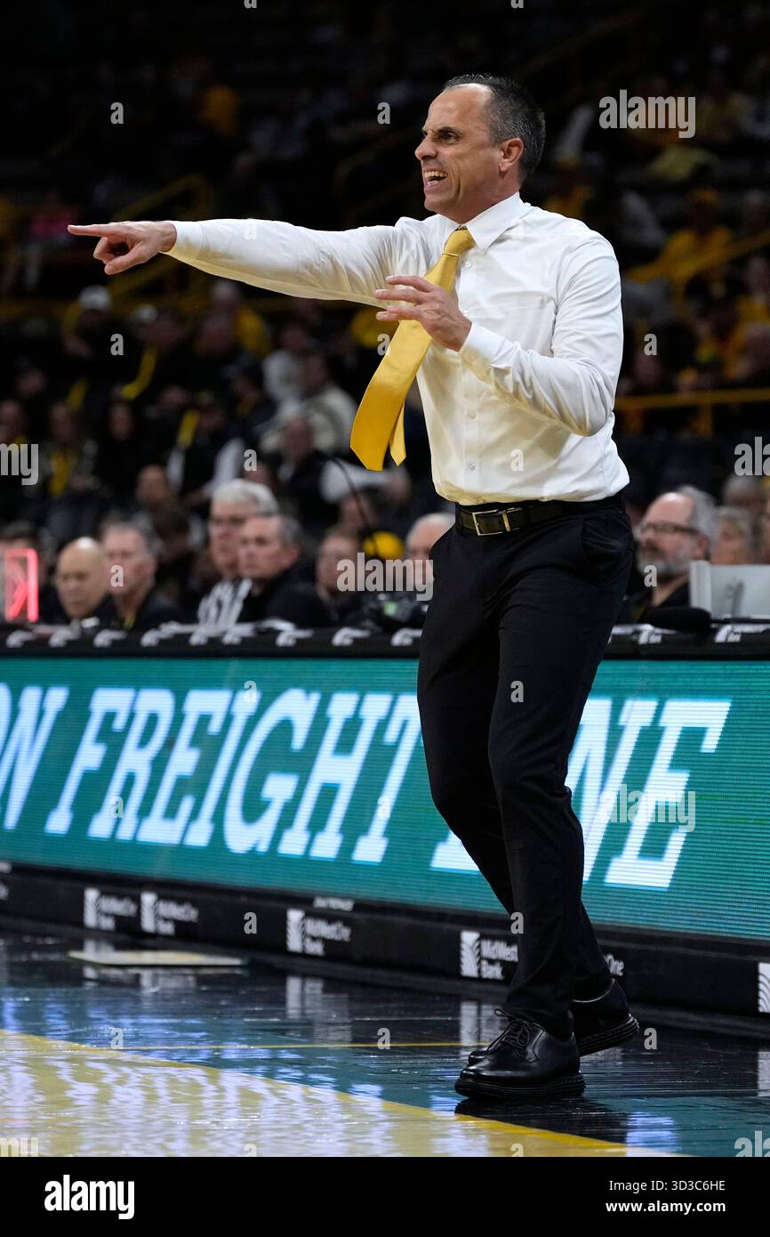 Iowa head coach Ben McCollum reacts during the first half of an NCAA ...