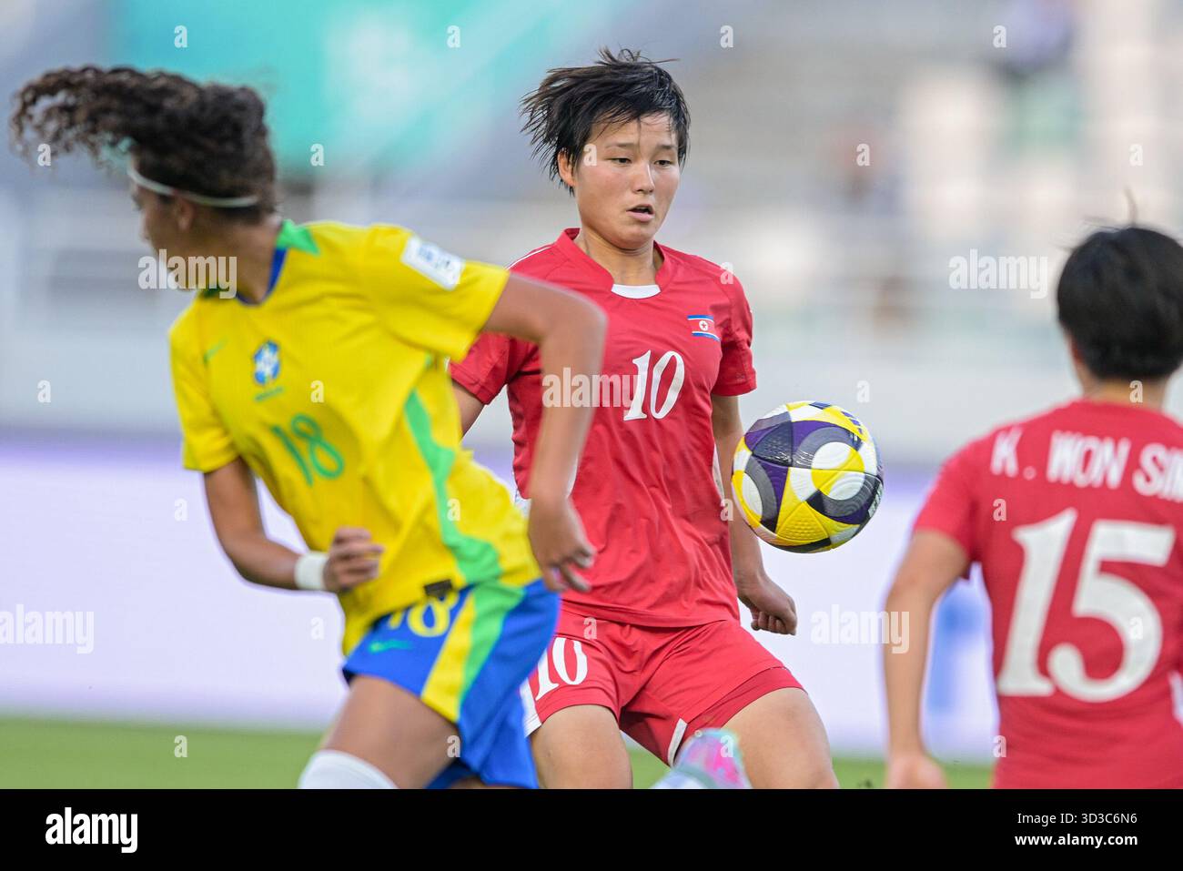 #10 Yu Y. Jong Hyang (Forward) of Korea DPR U-17 is in action during ...