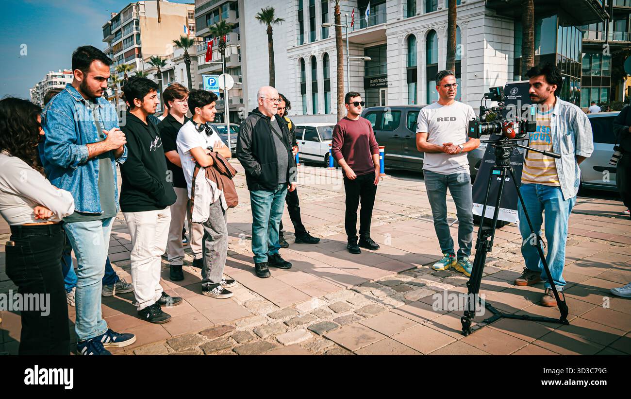 People learning how to use a movie camera during a cinematography ...