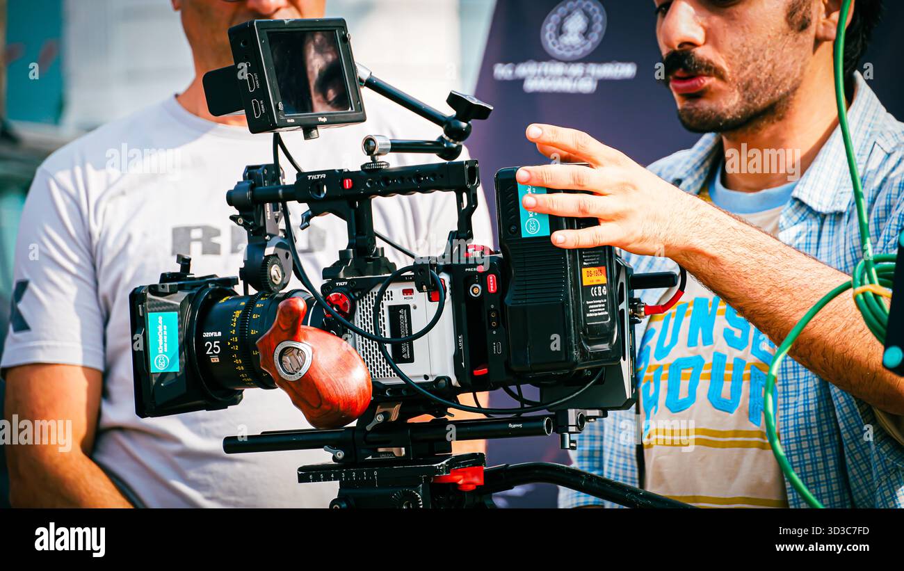 People learning how to use a movie camera during a cinematography workshop held as part of the ...