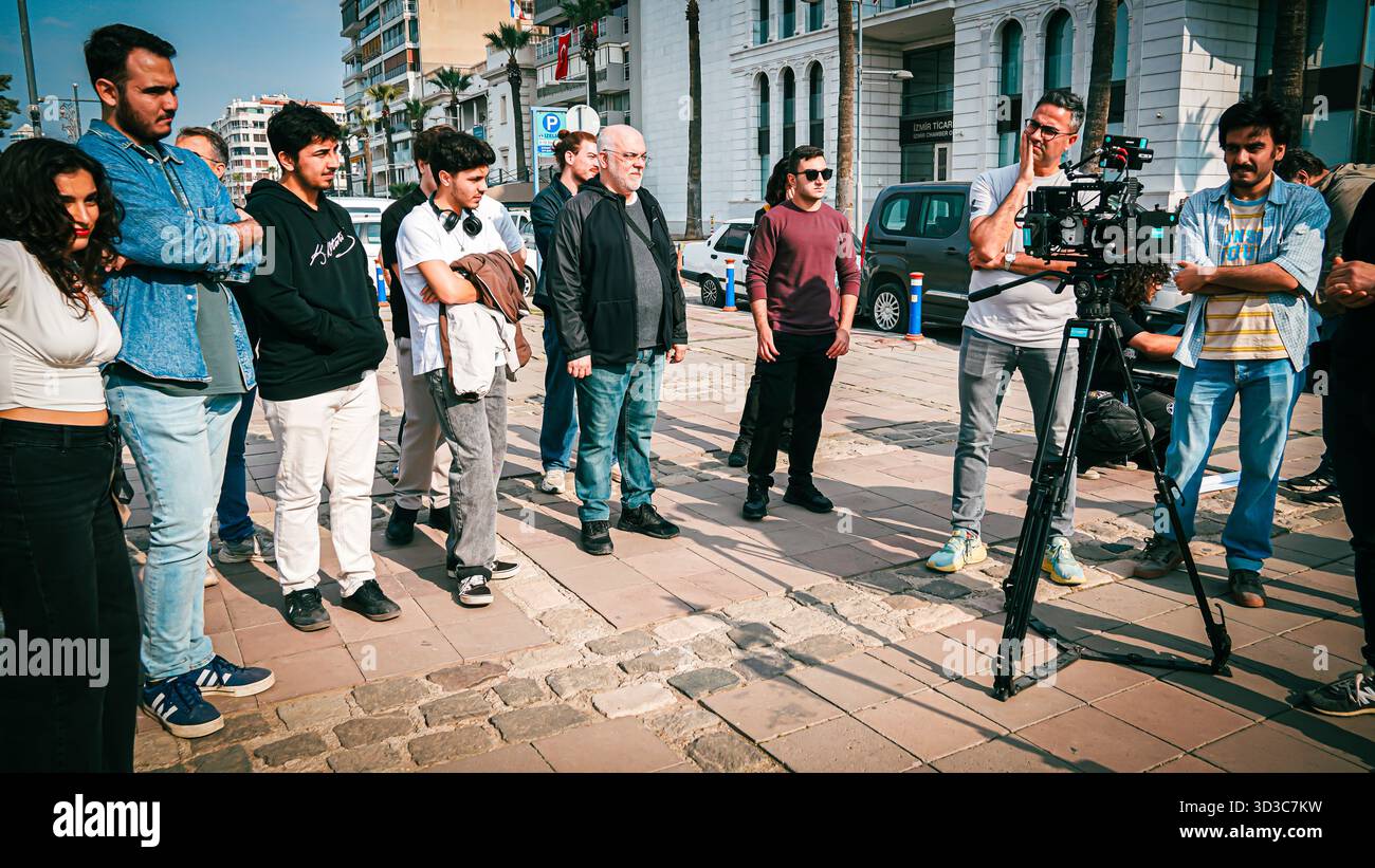 People learning how to use a movie camera during a cinematography ...