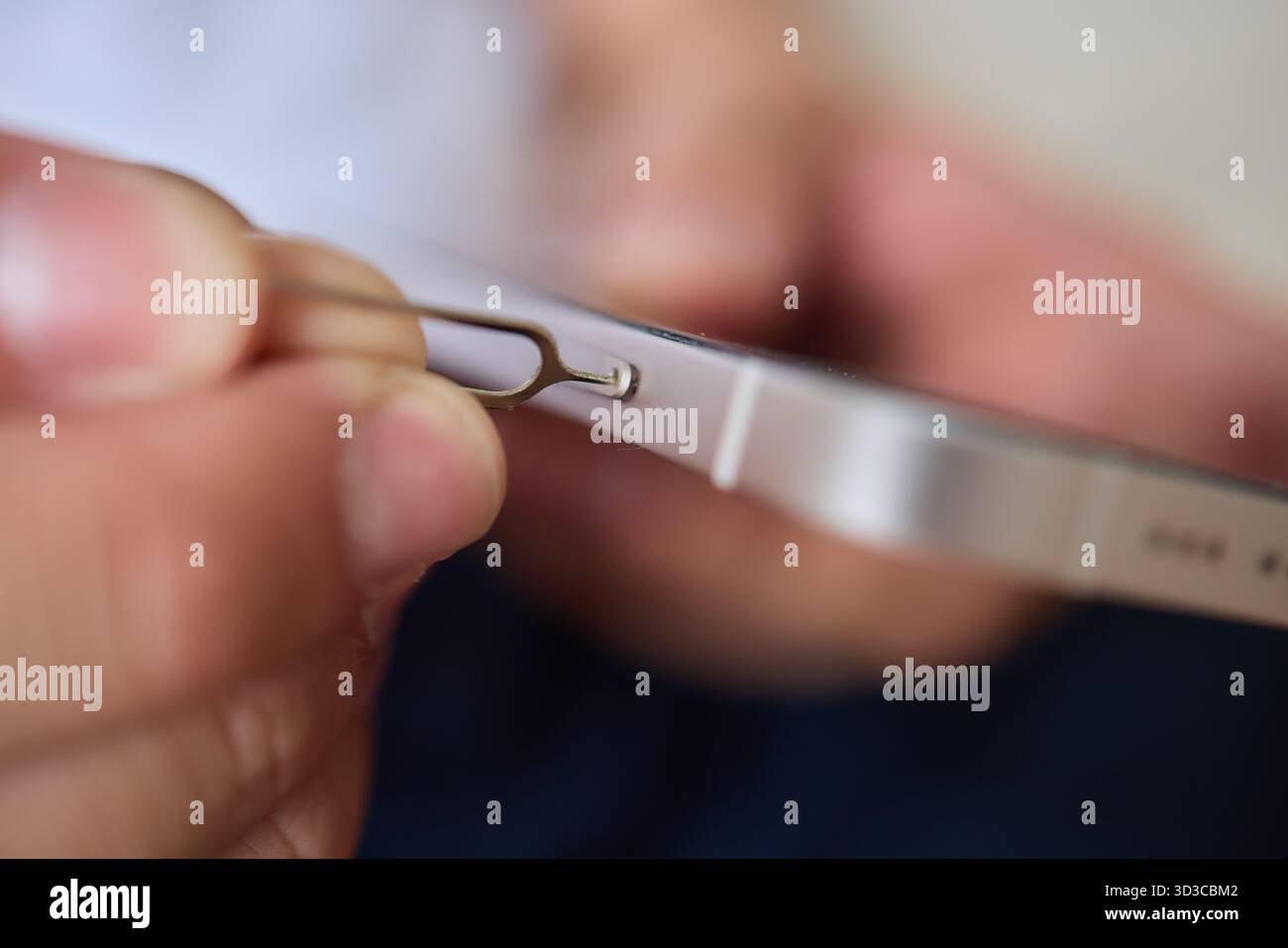 Guide on how to properly insert a SIM card into a smartphone using a ...