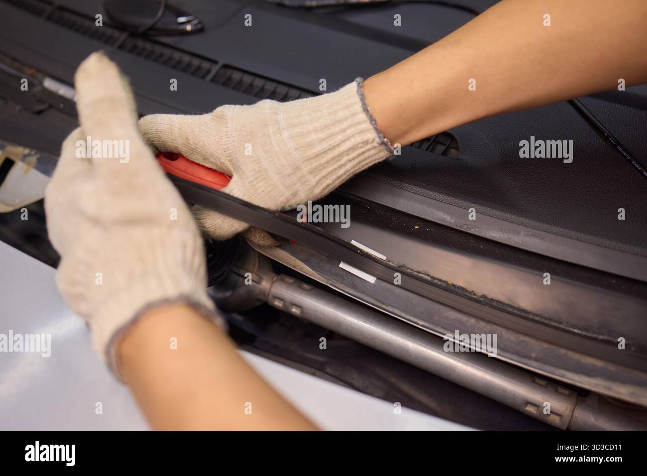 Installing windshield on a car with automotive design Stock Photo - Alamy