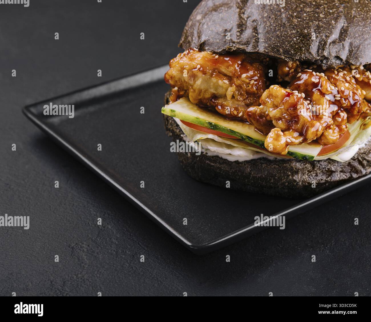 Food, Burgers with fried chicken strips on black tray Stock Photo - Alamy