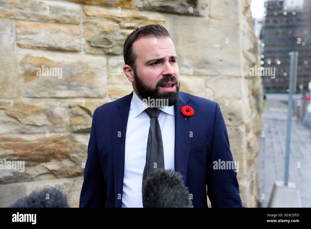Conservative MP Aaron Gunn responds to journalists' questions on the ...