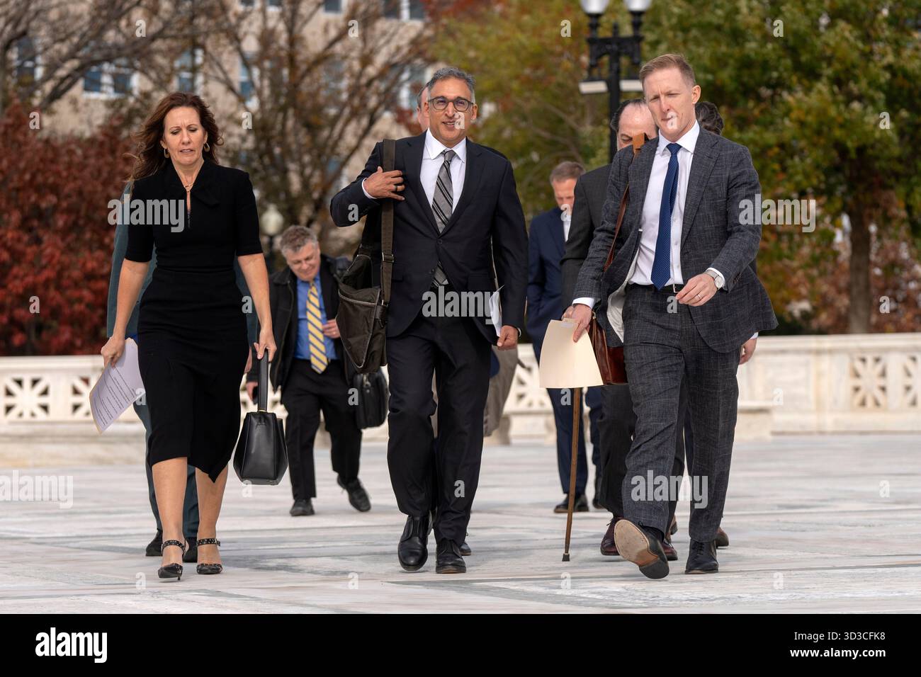 Attorney Neal Katyal, center, walks outside the Supreme Court on ...
