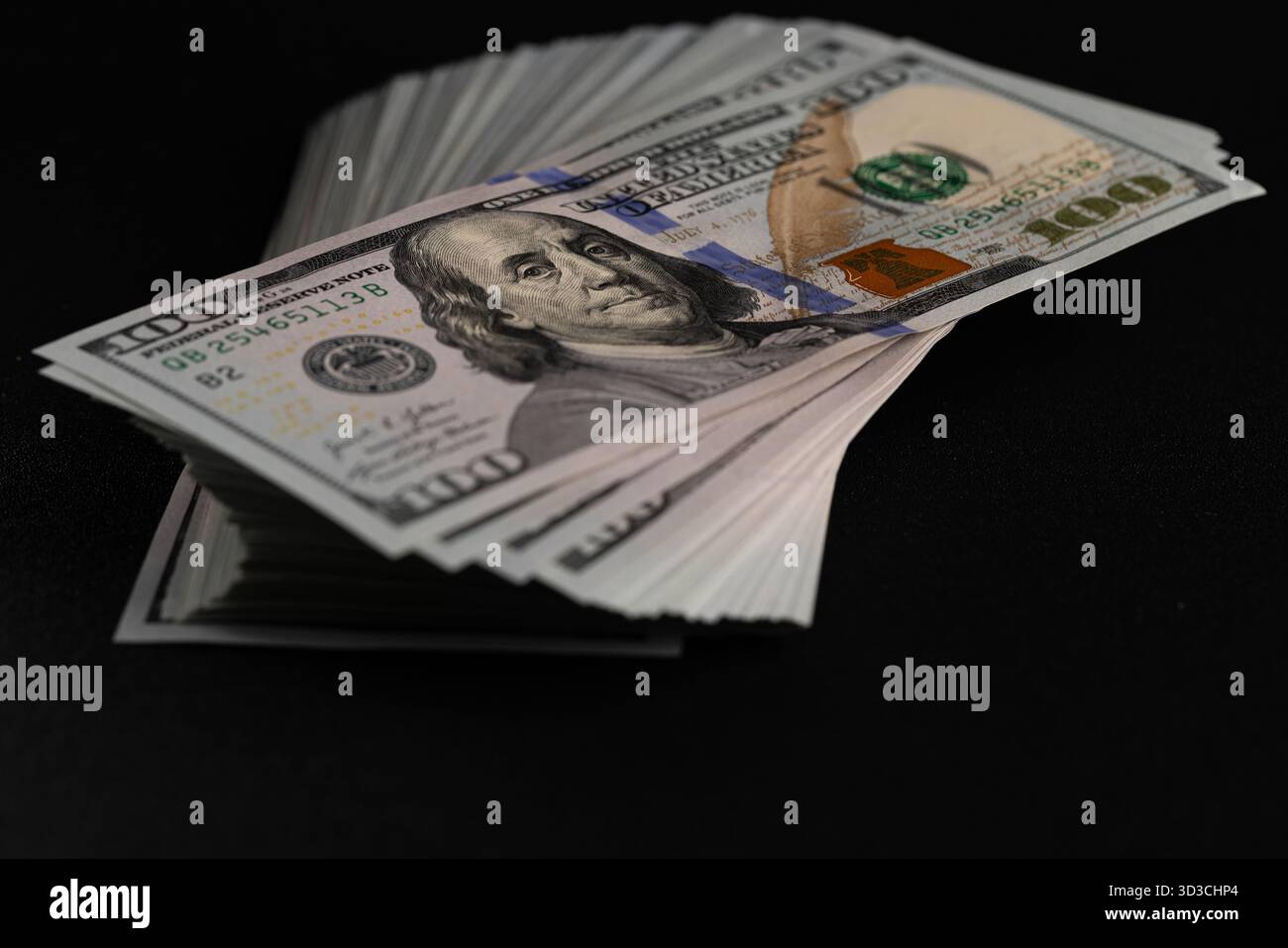 Thick Stack of Hundred Dollar Bills on Black Background Stock Photo - Alamy