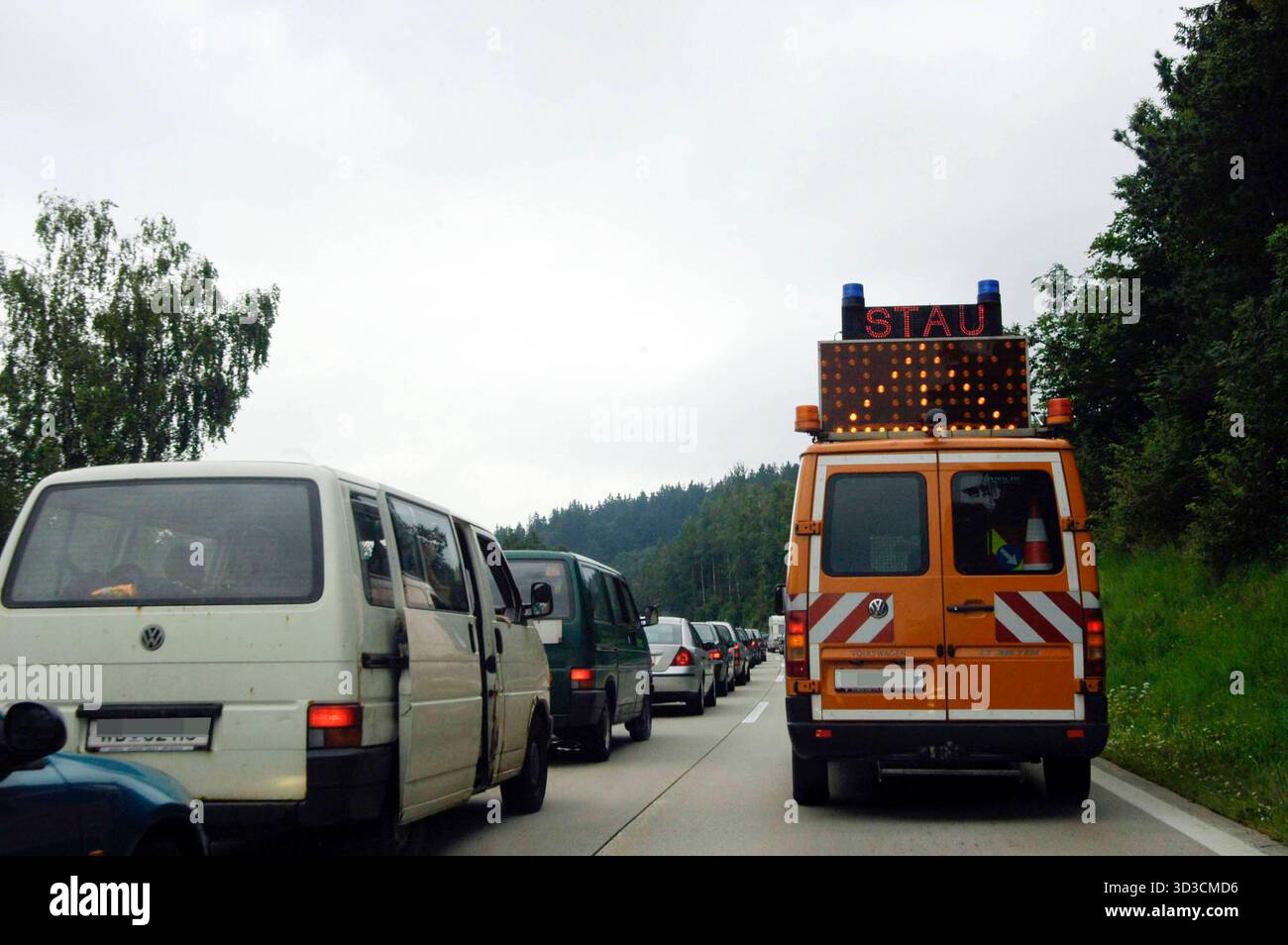 a traffic congestion warning road sign standing on the street traffic ...