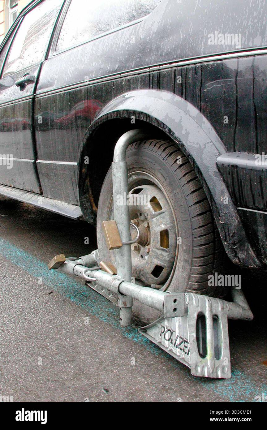 parking clamp on the tyre of a car for parking offence parking clamp on ...