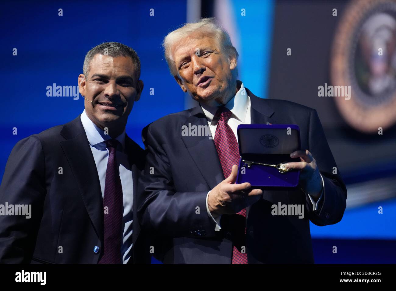 President Donald Trump speaks with Miami Mayor Francis Suarez after ...