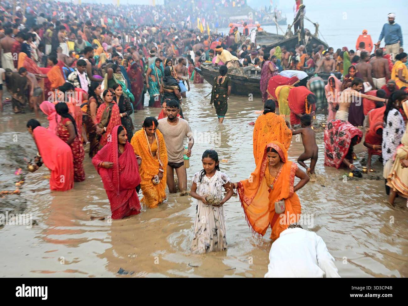 PATNA, INDIA - NOVEMBER 5: Devotees taking holy bath in Ganga river on ...