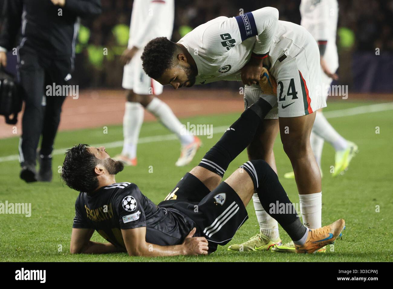 Chelsea's Reece James, right, assists Qarabag's Elvin Jafarguliyev during the Champions League ...