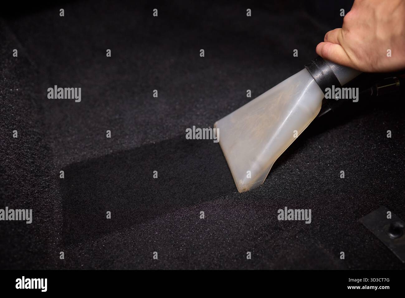 Use a professional vacuum extraction tool for comprehensive car carpet ...