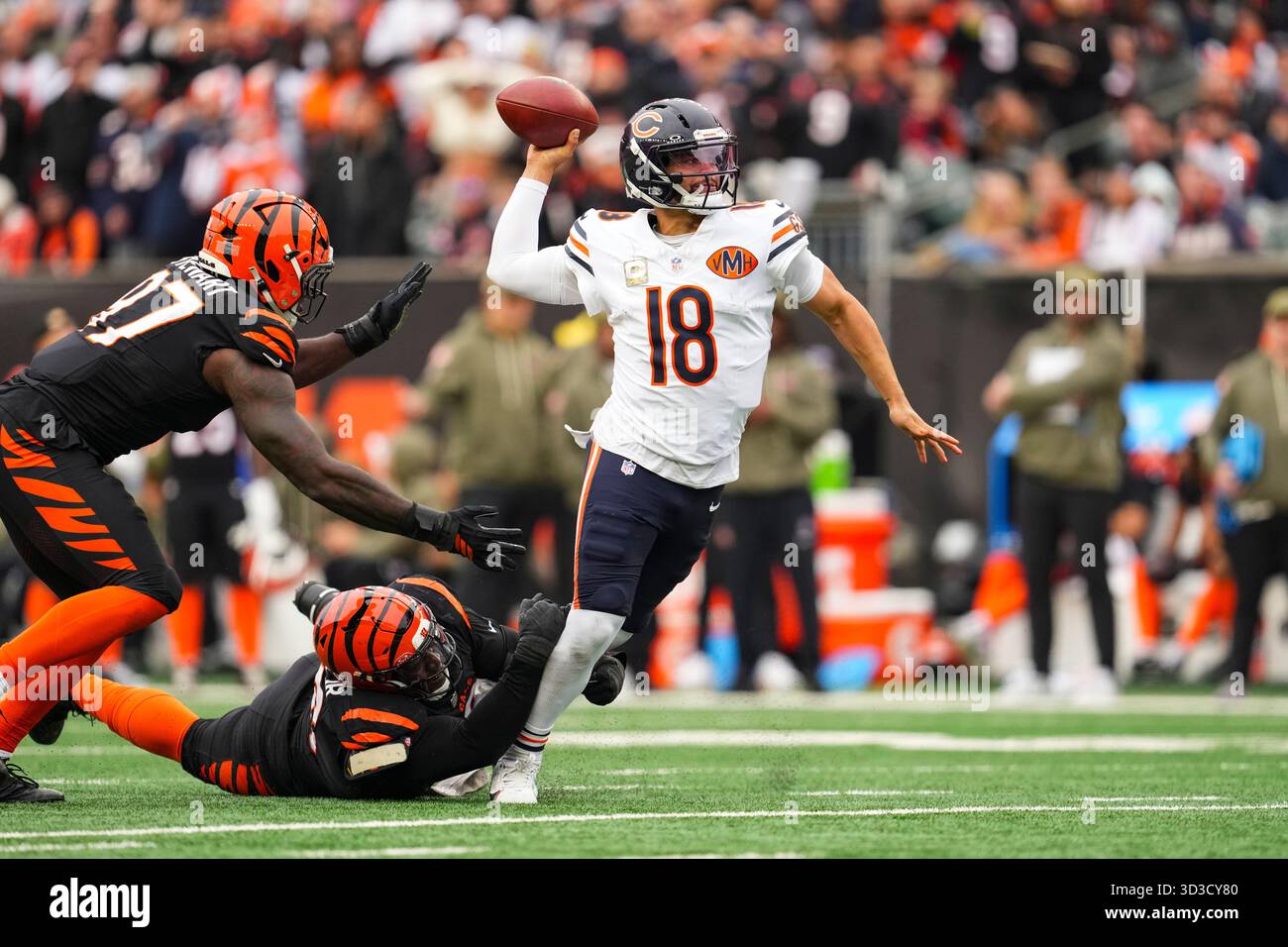 Chicago Bears quarterback Caleb Williams (18) is pressured by ...