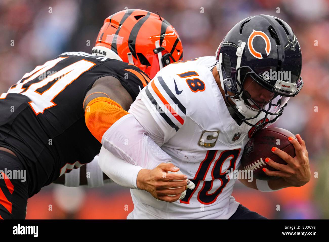 Chicago Bears quarterback Caleb Williams (18) is tackled by Cincinnati ...