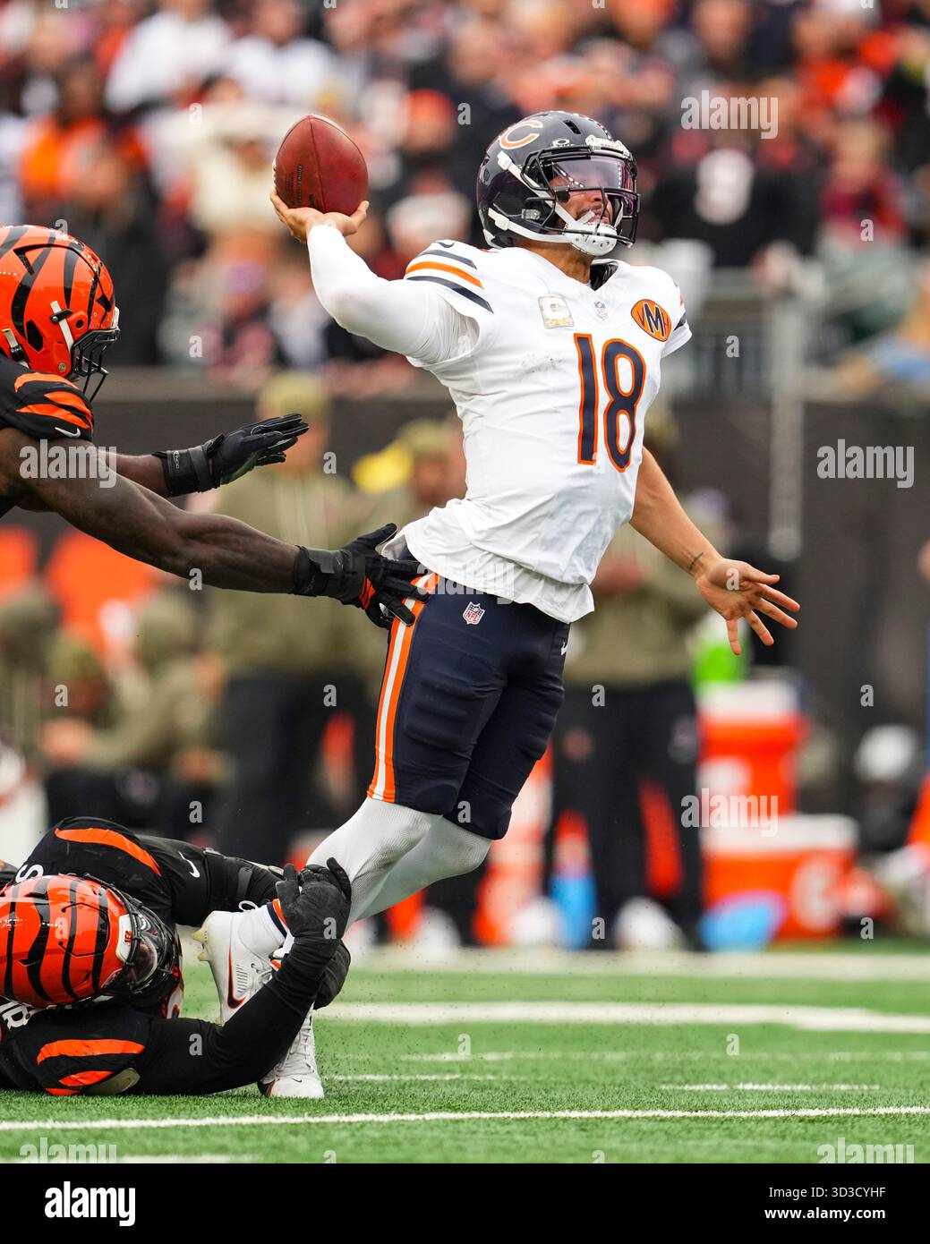 Chicago Bears quarterback Caleb Williams (18) is pressured by ...