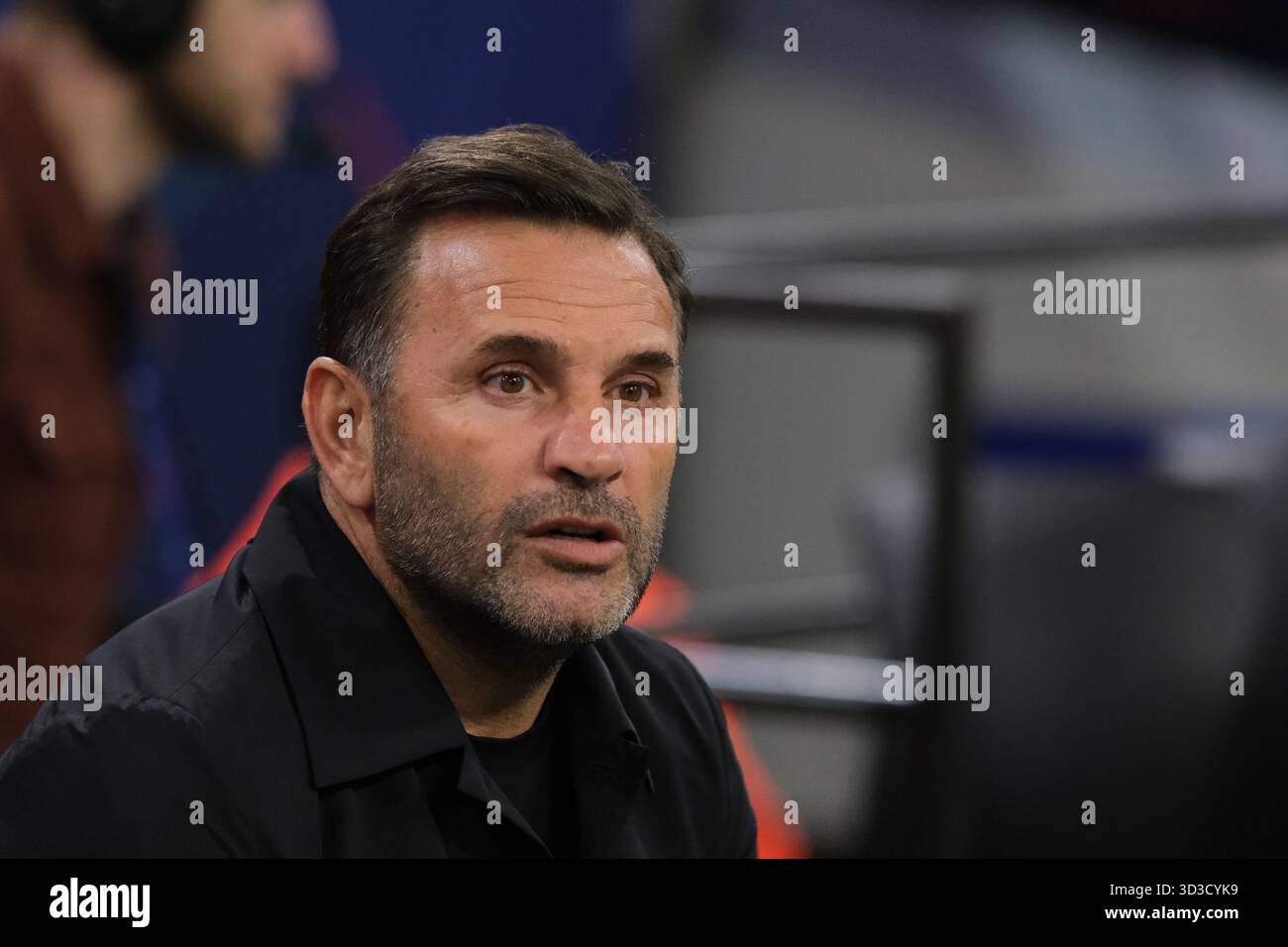 Galatasaray's head coach Okan Buruk sits on the bench before the ...