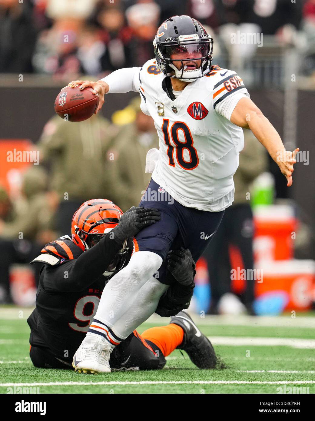 Chicago Bears quarterback Caleb Williams (18) is pressured by ...
