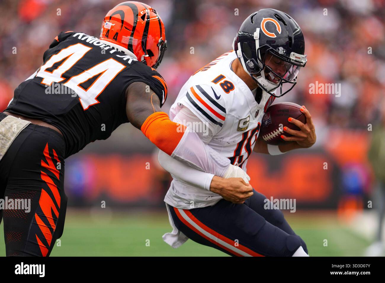 Chicago Bears quarterback Caleb Williams (18) is tackled by Cincinnati ...